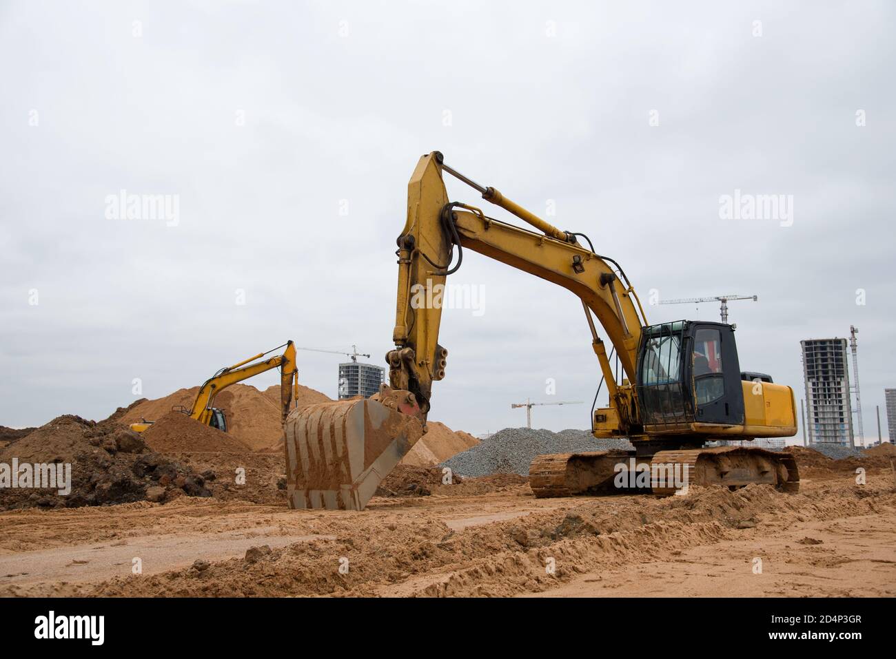 Excavators digging foundation construction site hi-res stock ...