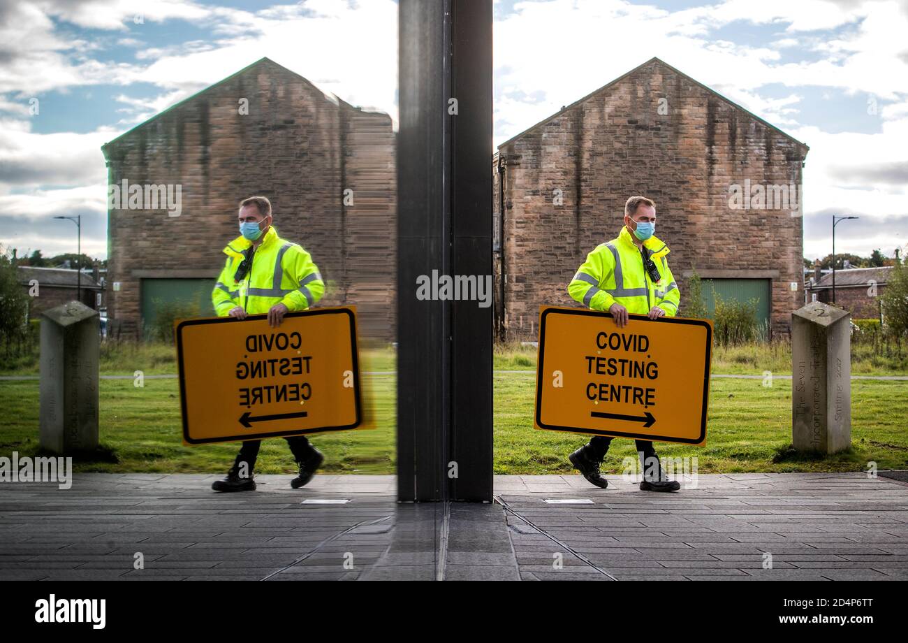 Jim Connell sets up signs at a new walk-through Covid test centre at ...