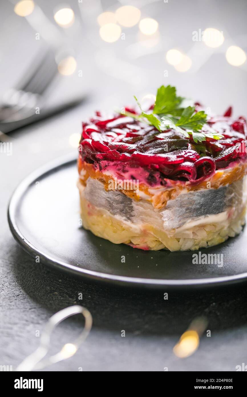 Shuba salad. Russian layered salad with beet, potato, carrot, pickled ...