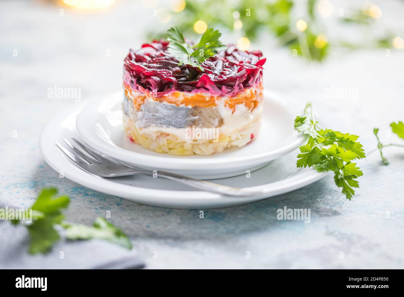 Shuba salad. Russian layered salad with beet, potato, carrot, pickled ...