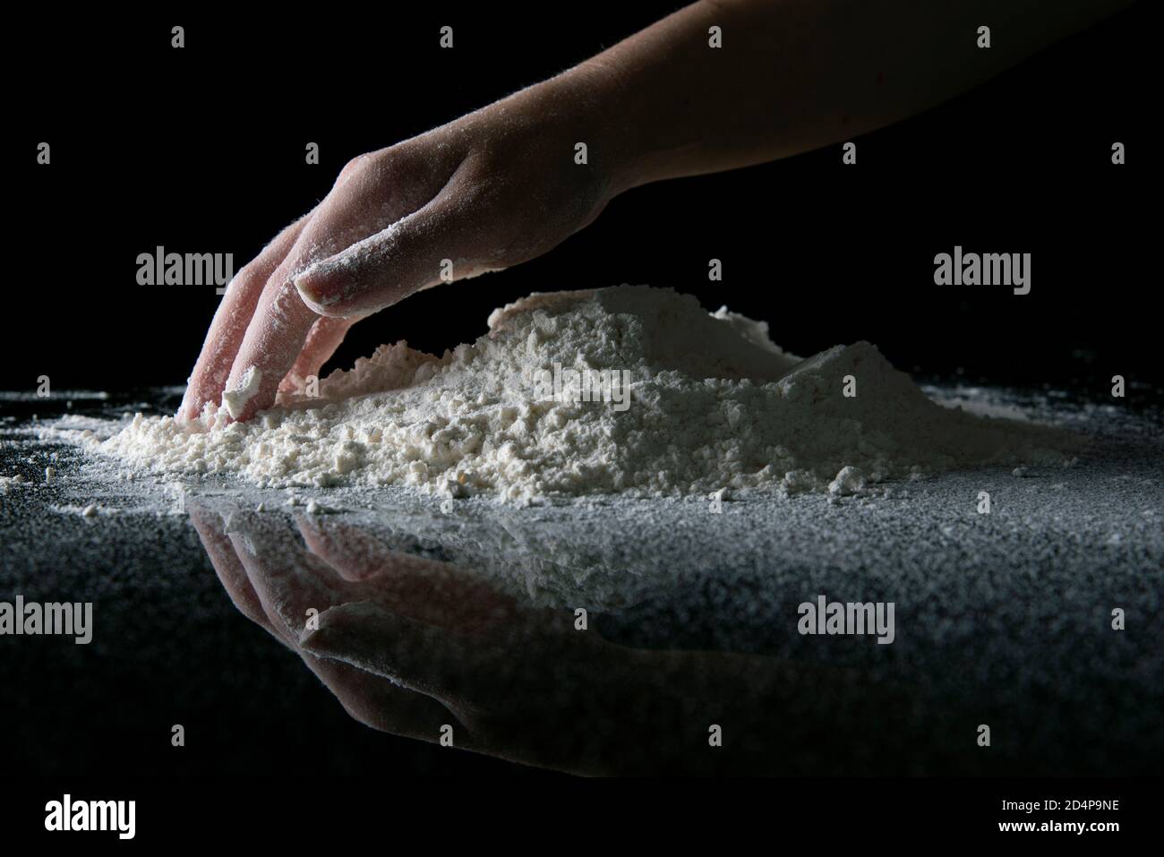 white flour in black background. Bakery moment Stock Photo - Alamy