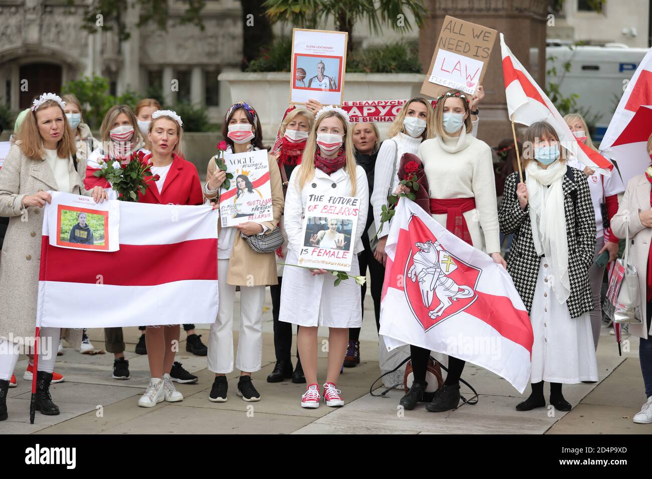 Women, marching, in solidarity with the women of Belarus, stand in ...