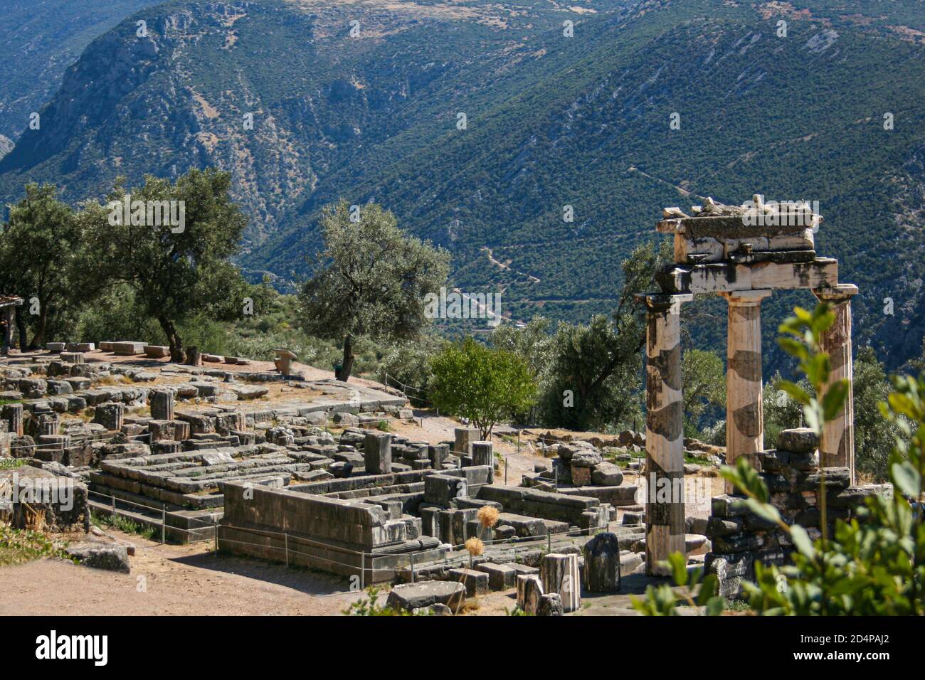 The sanctuary of Athena Pronaia at Delphi arhcaeological site with the ...
