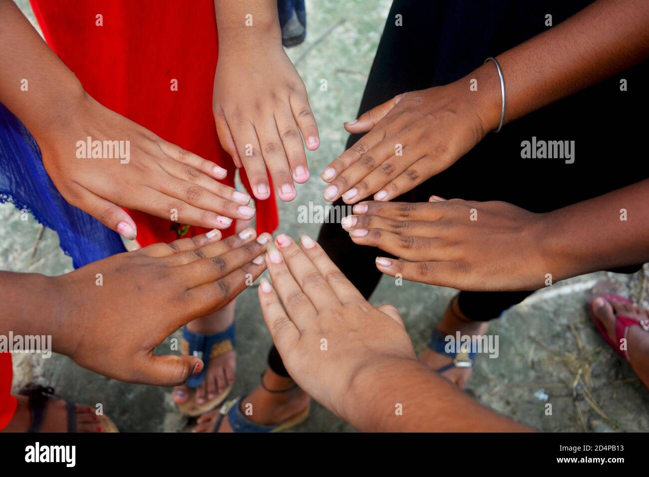 Close up of left hands of six girls showing their finger nails ...