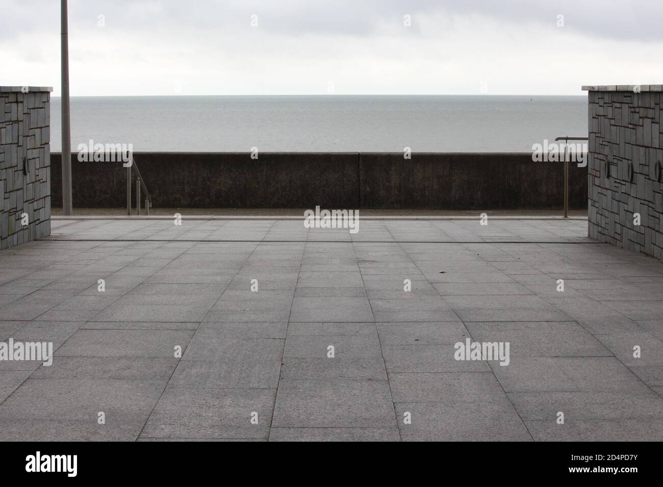 A photograph of the wall on Mumbles sea front, looking out to sea, with ...