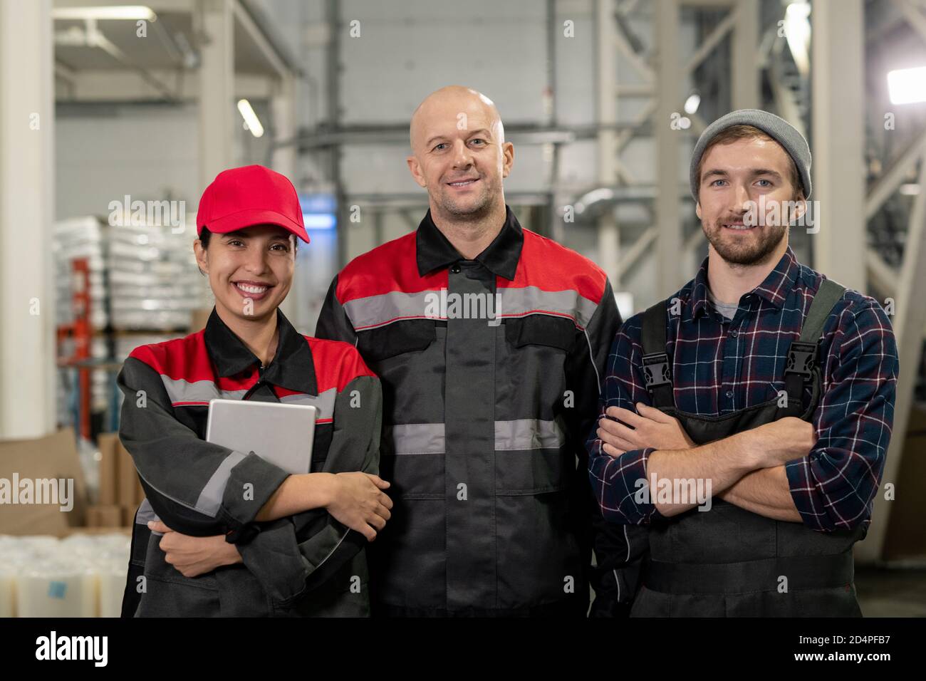 Group of successful and cheerful male and female engineers of large ...