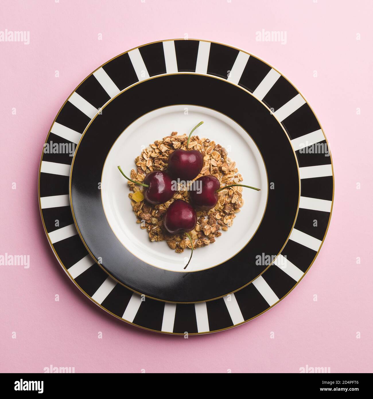 Top down view of four cherries in a bed of flakes, in black and white ...