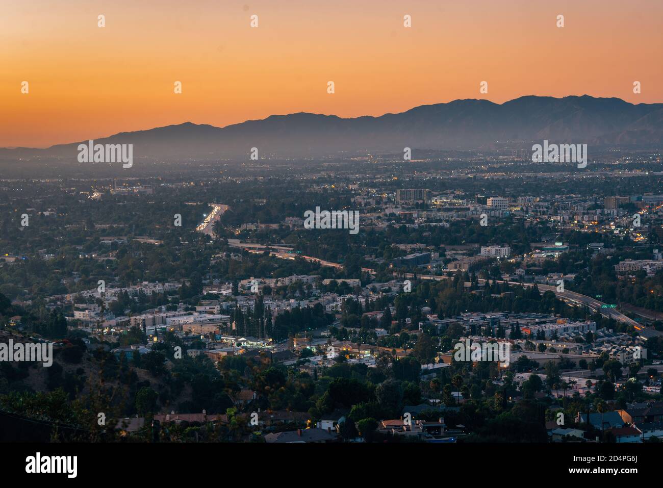 View of the San Fernando Valley at sunset, from Mulholland Drive, in ...