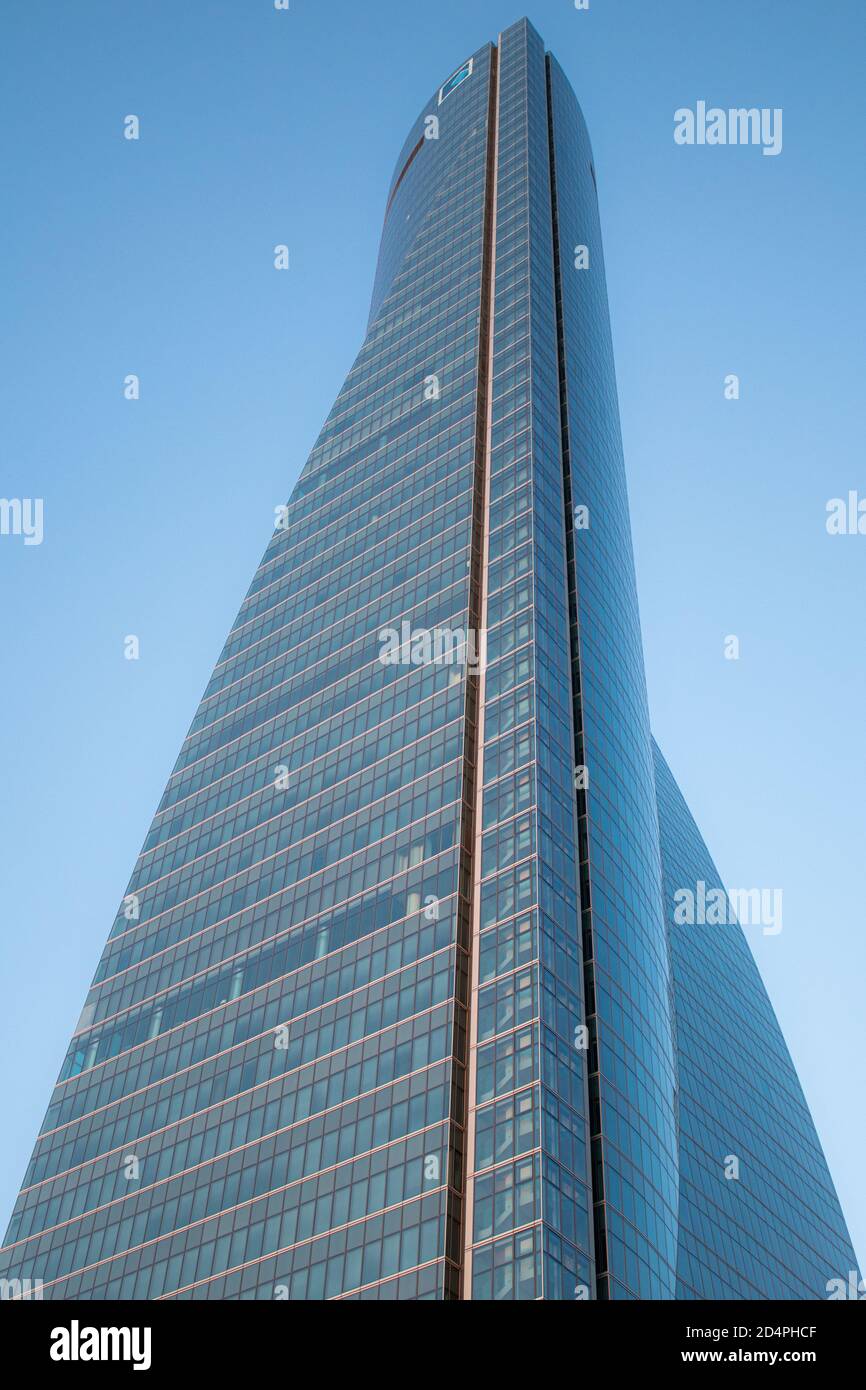 Vertical low angle shot of a tall modern glass building Stock Photo - Alamy