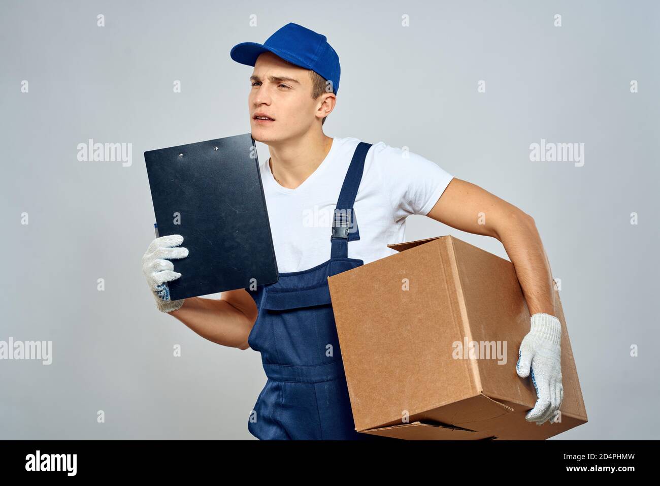 Man worker with box in hands delivery loading service packing service ...