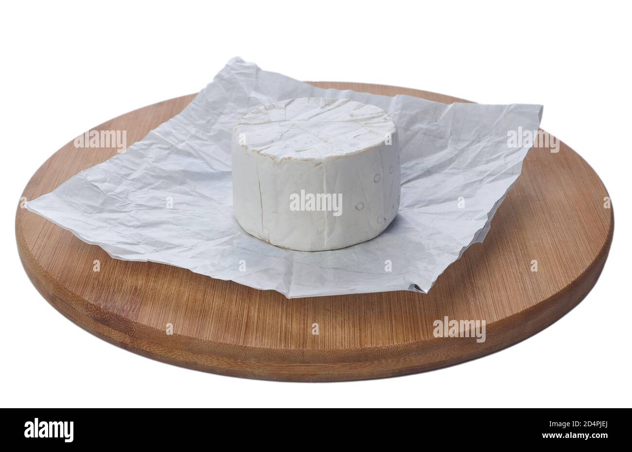 Camembert cheese with white mold on a round board isolated on a white ...