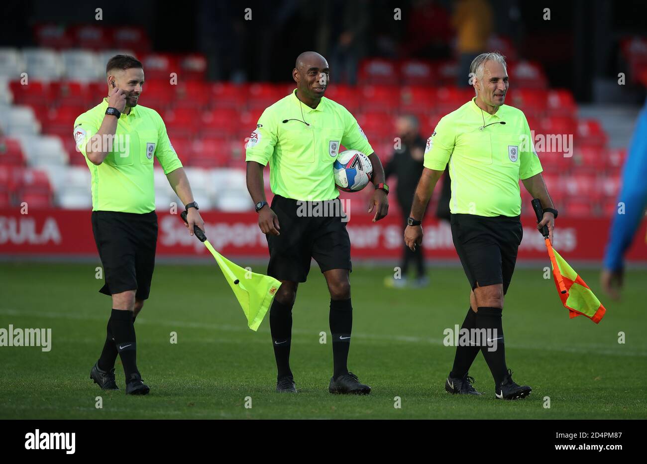 Match referee Sam Allison (centre) with assistants Matthew Smith (left ...