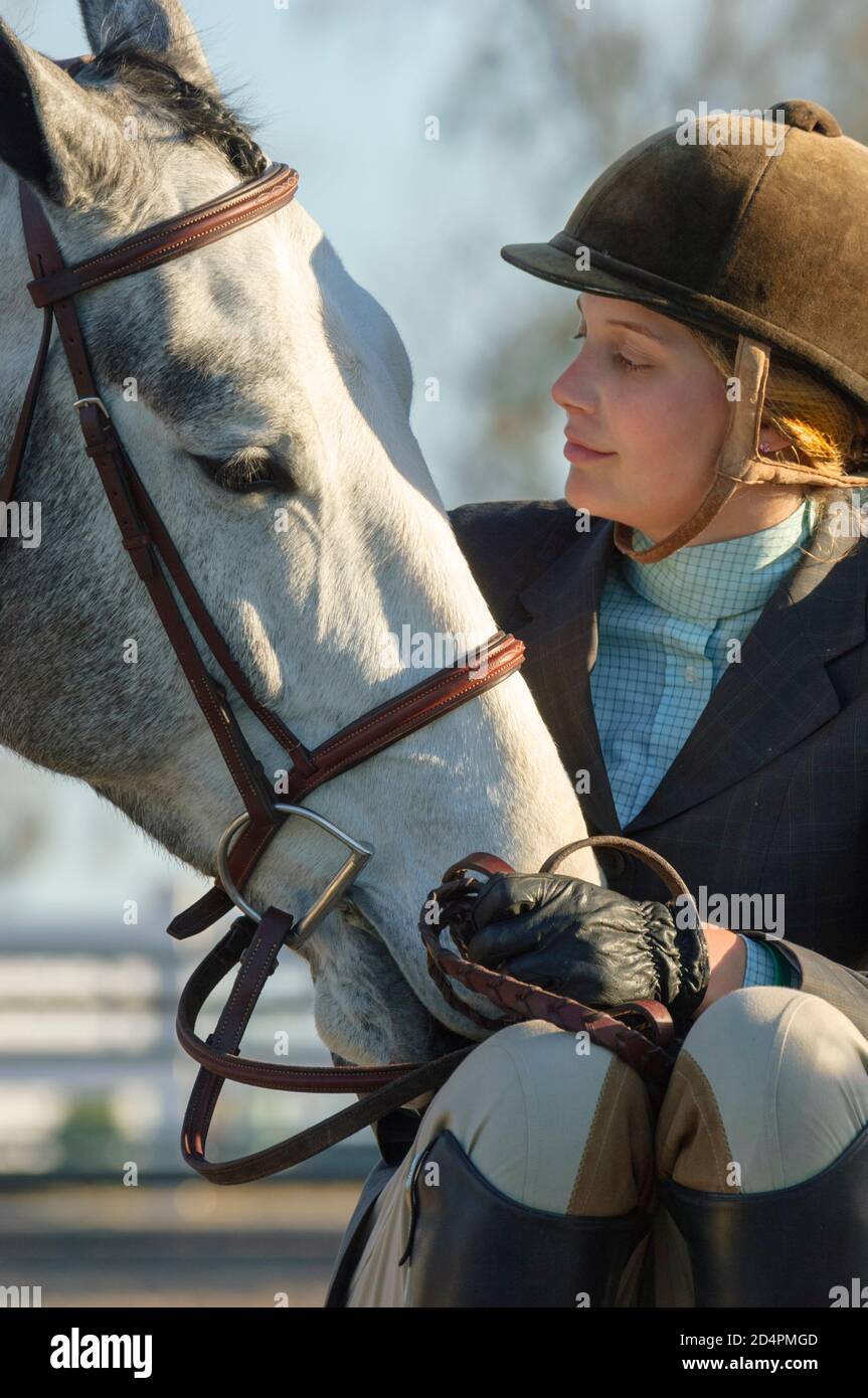 Teen girlsand horses at show jumping event Stock Photo - Alamy