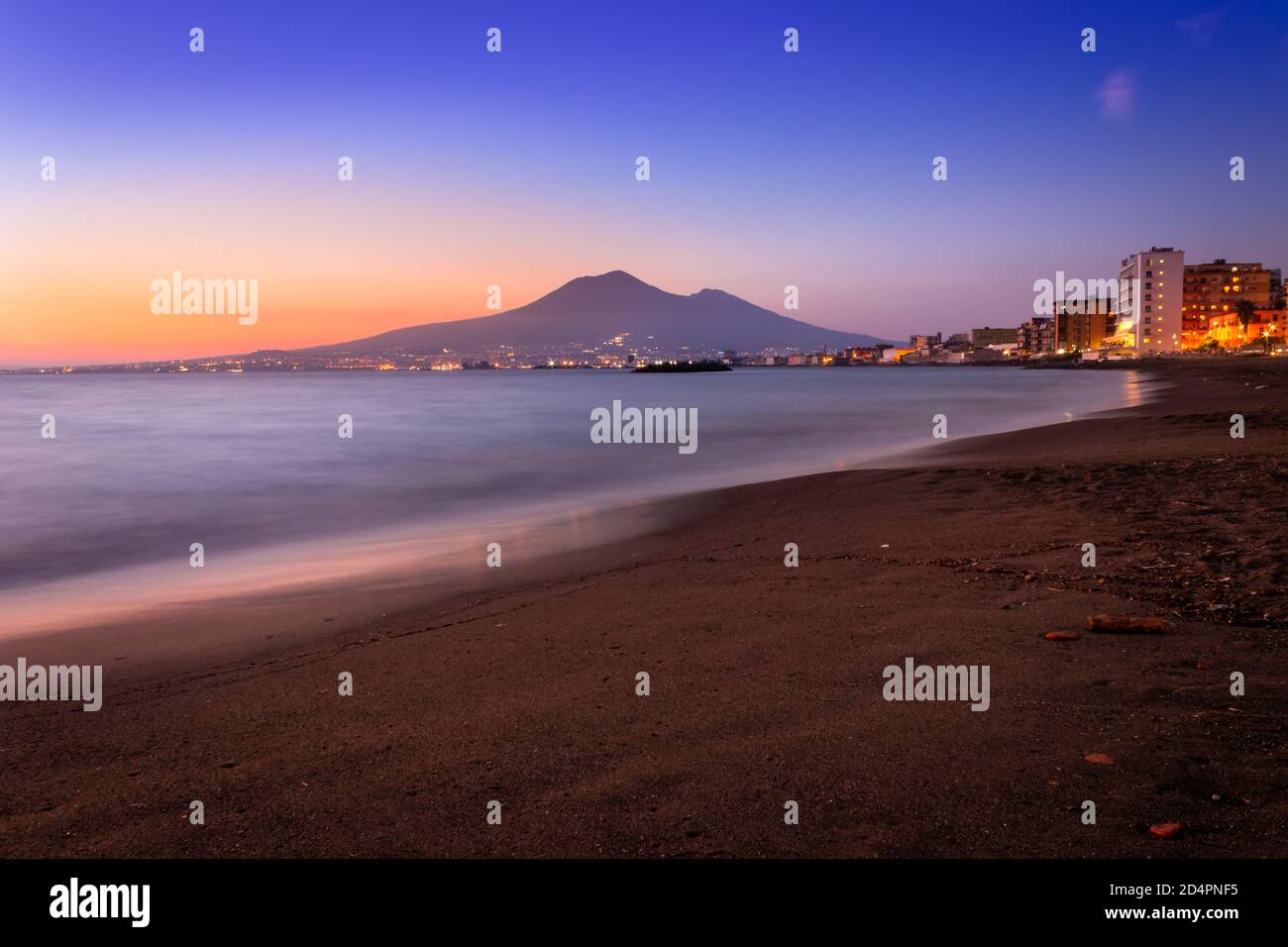Sunset from a beach in Castellammare di Stabia and Mount Vesuvius and ...
