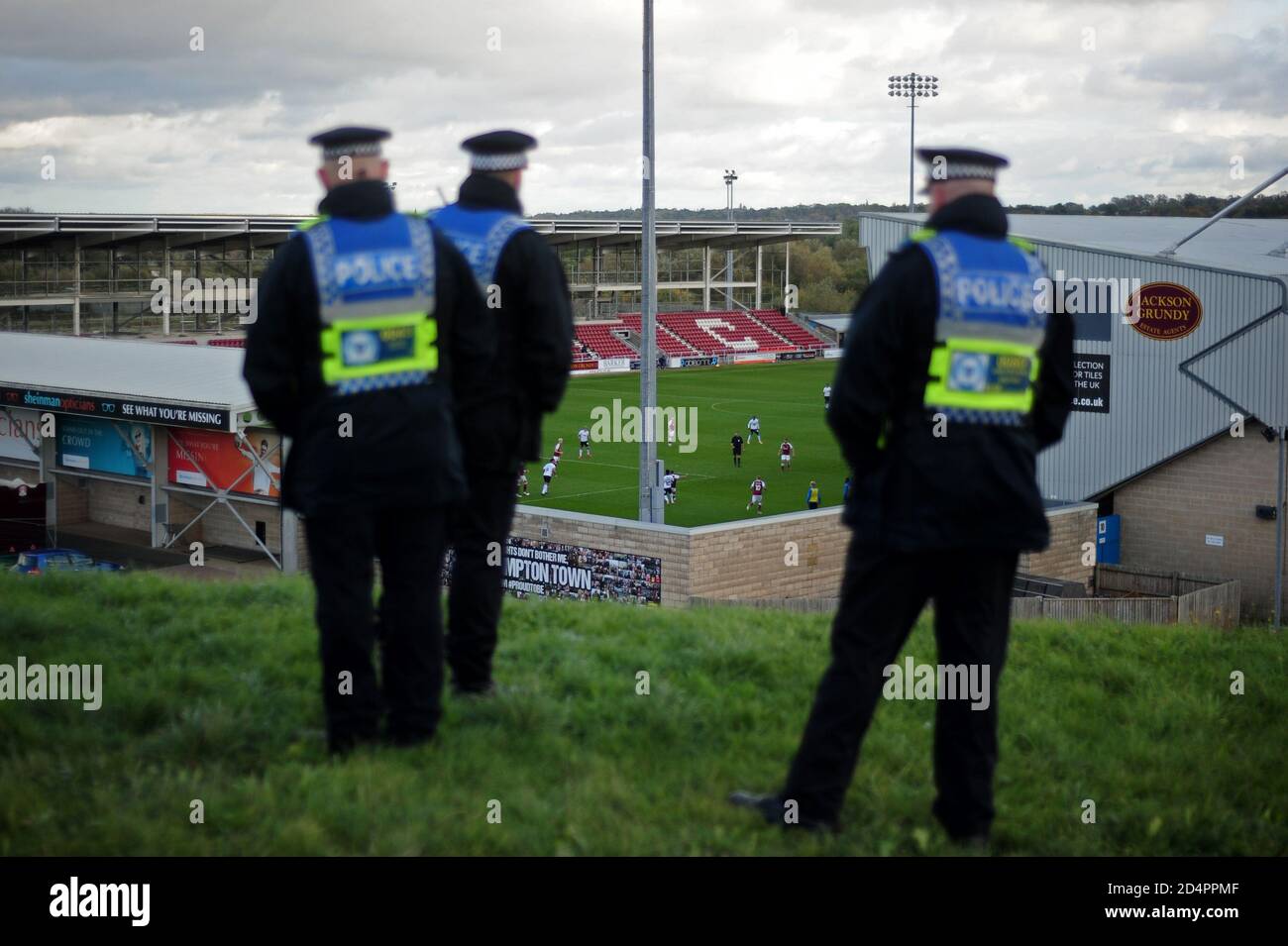 A general view of police officers watching from outside the ground ...