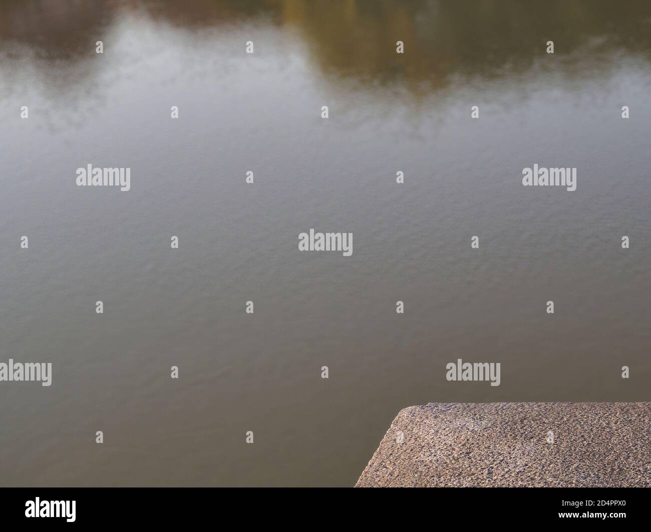 Pond with a reflection of a tree and a platform Stock Photo - Alamy