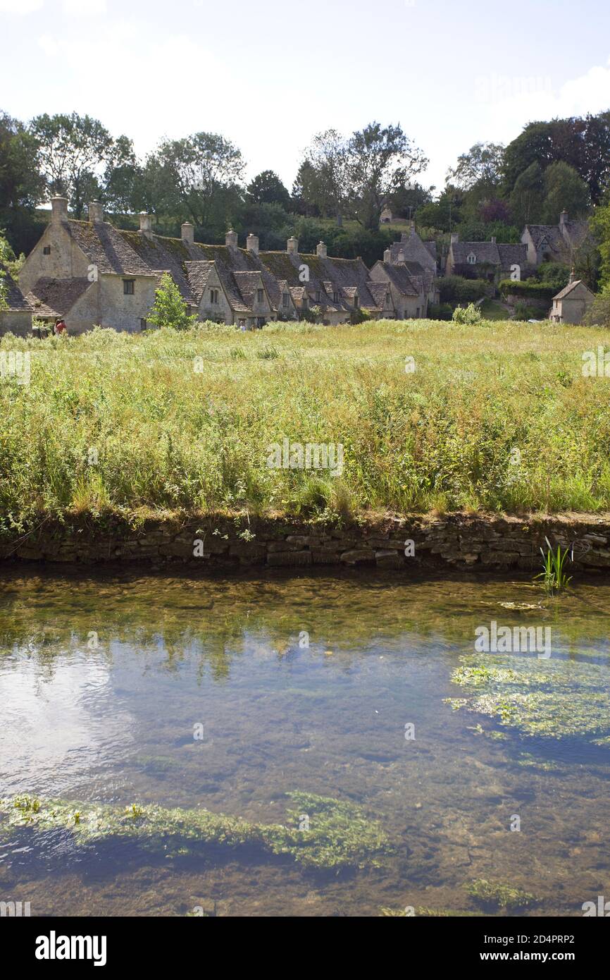 Picturesque cottages at Arlington Row in the Cotswolds village of ...