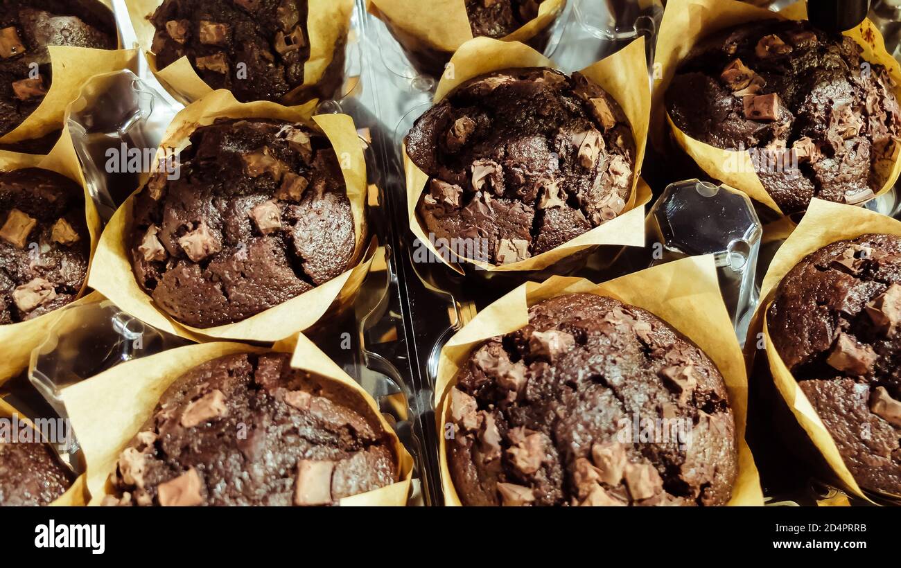 Fresh and tasty muffins on display at the supermarket Stock Photo - Alamy