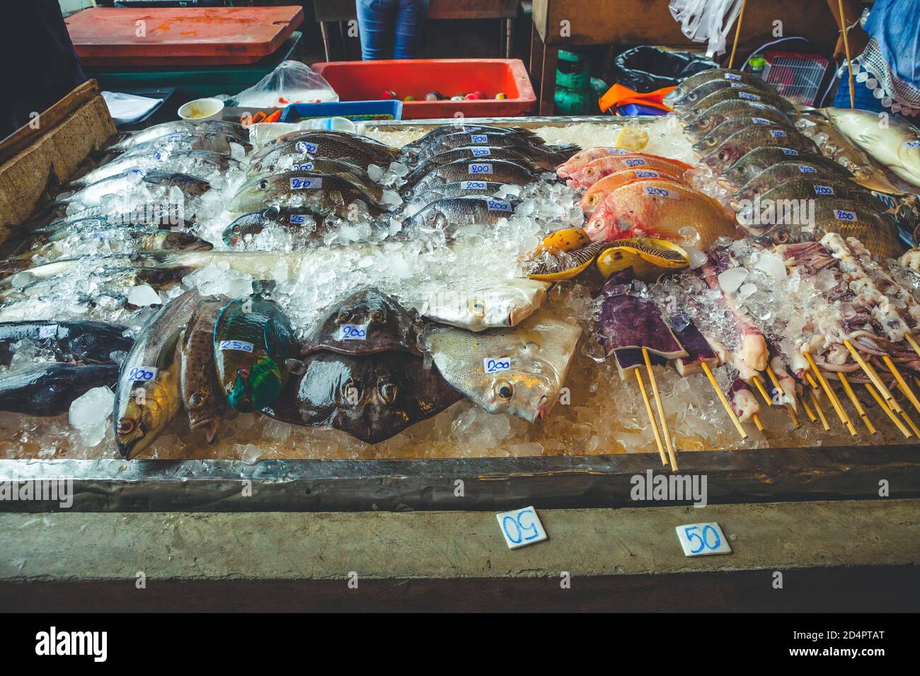 Sale of fish products at a street stall in Thailand. Different types of ...