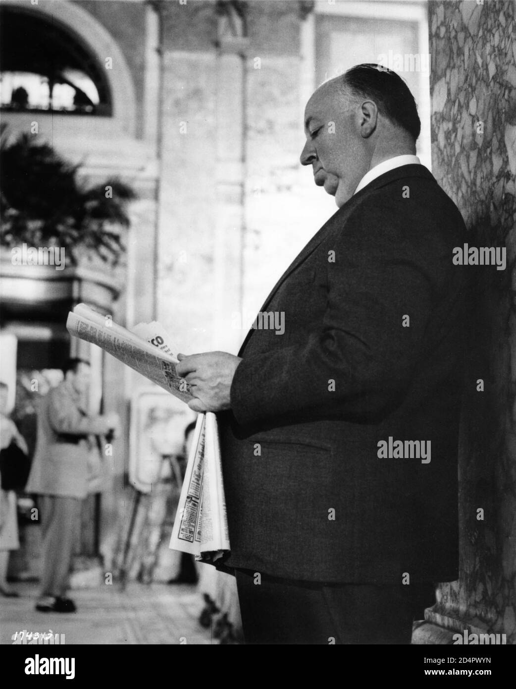 Alfred Hitchcock On Set Location Candid Standing In Lobby Of The New York Plaza Hotel During