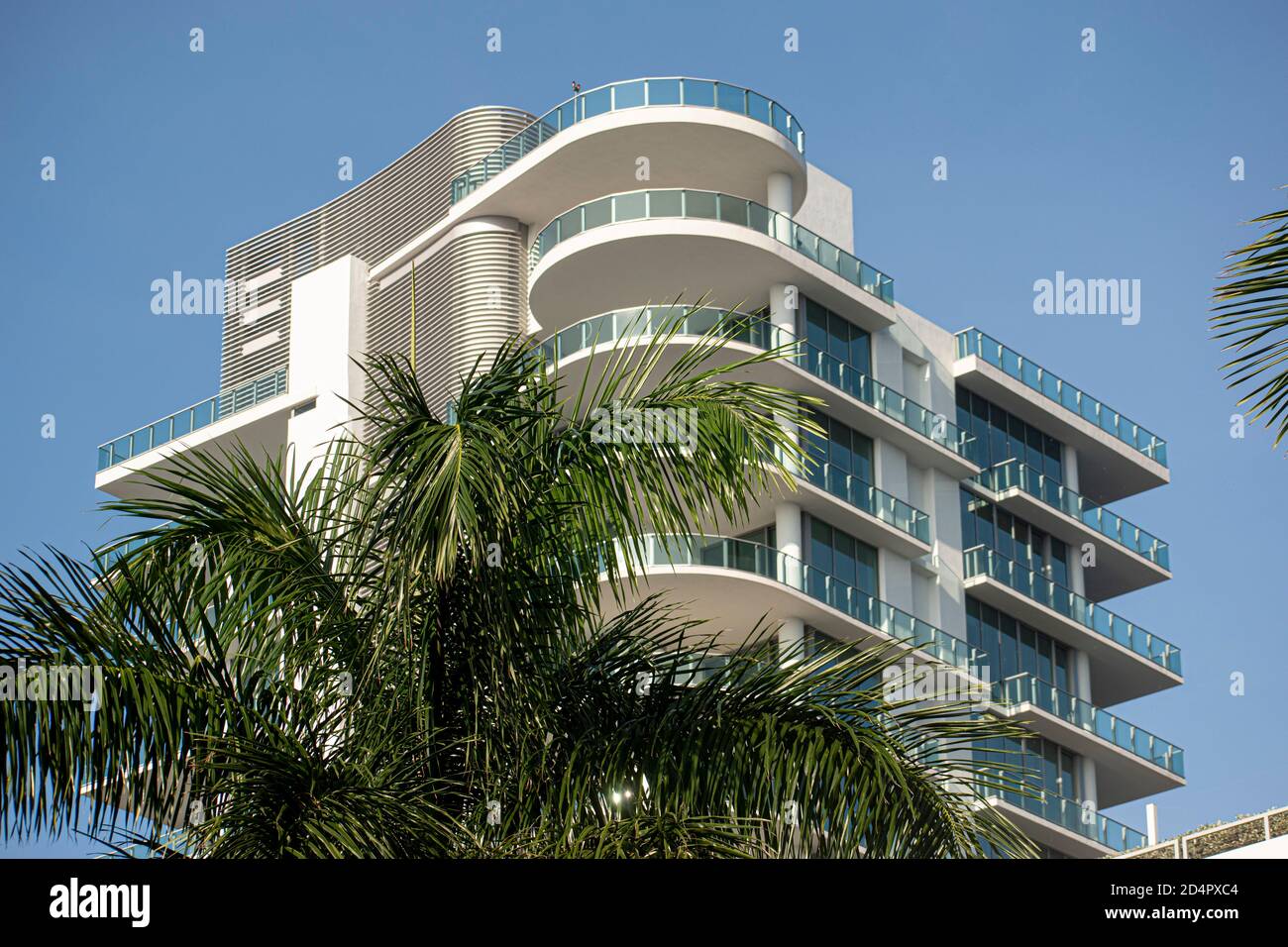 white modern cement building with big balconies in north miami beach ...
