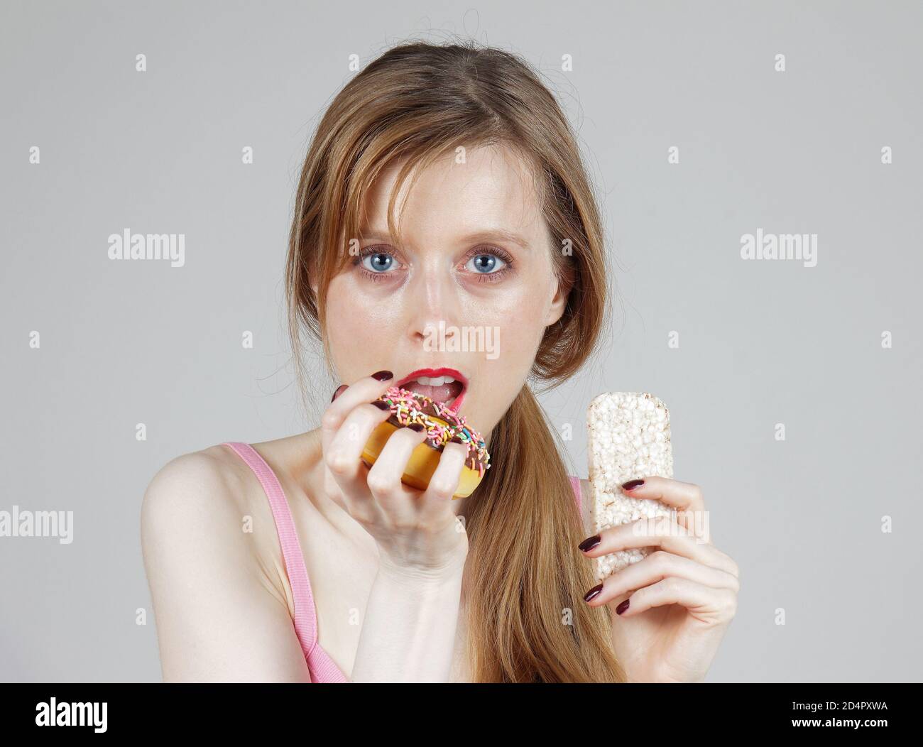 Woman eating donut hi-res stock photography and images - Alamy