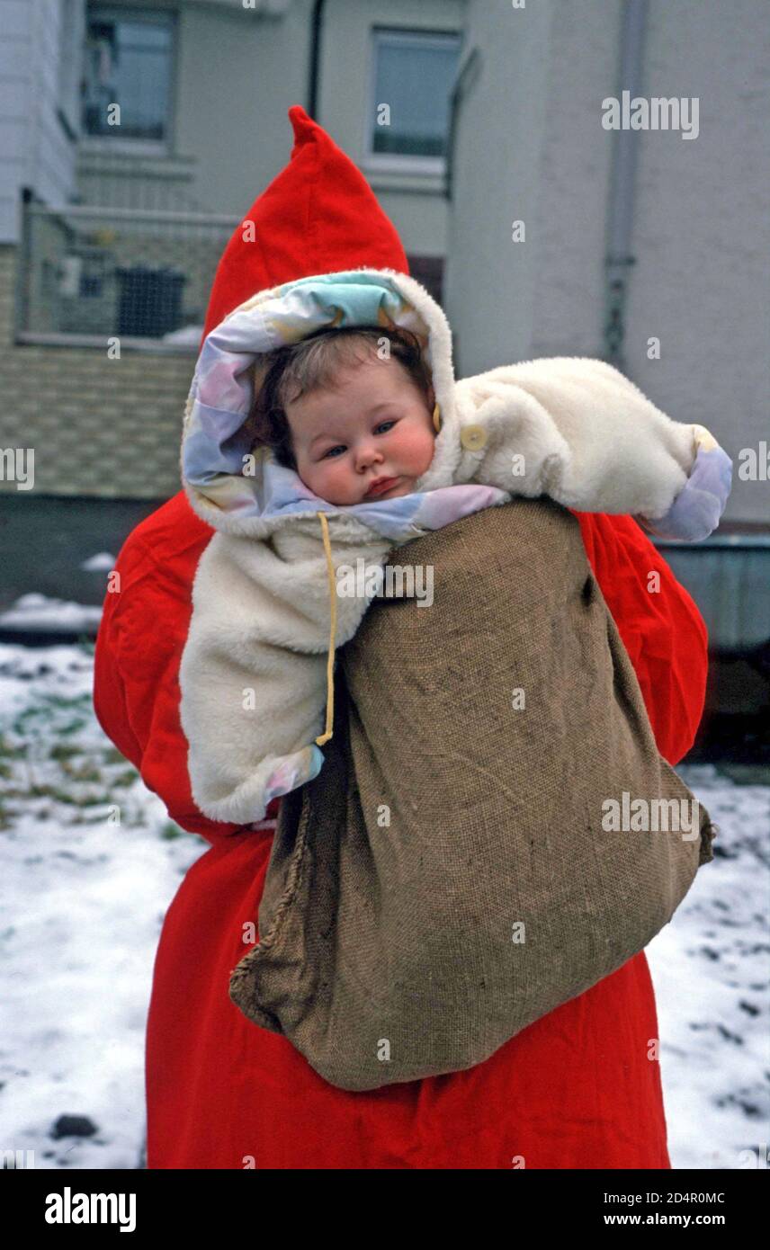 A baby as a present, Santa Claus, Christmas, Sack, Lauda Germany Stock ...