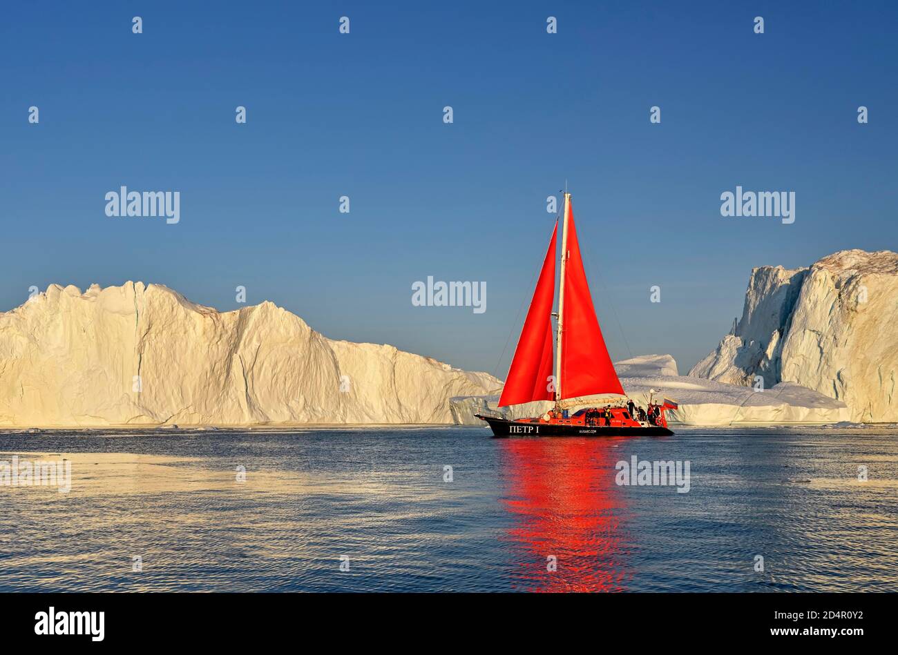 Red sailing boat in front of icebergs, Icefjord, UNESCO World Heritage ...