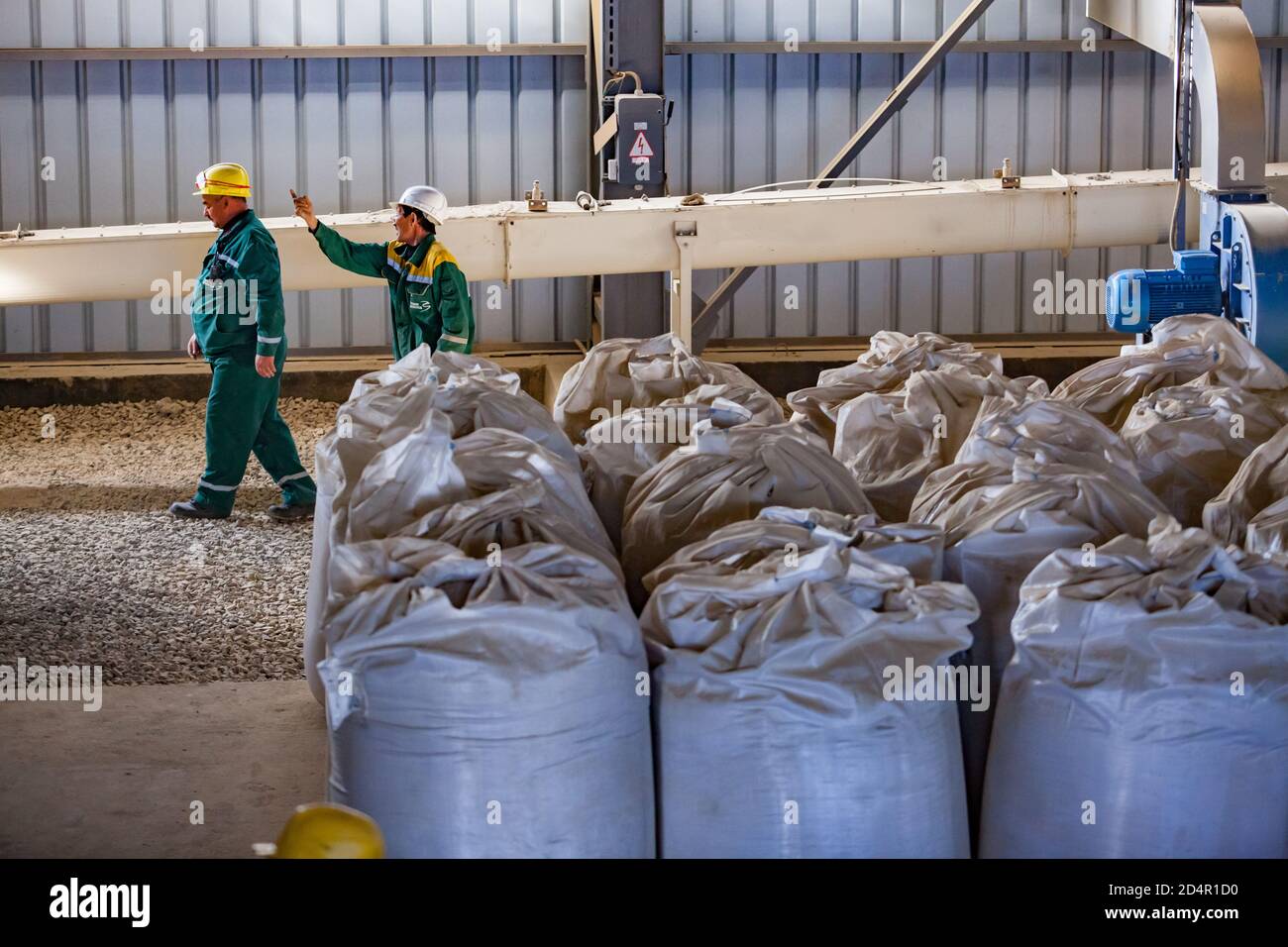 Phosphate fertilizers plant. Plastic bags with fertilizer pellets and ...