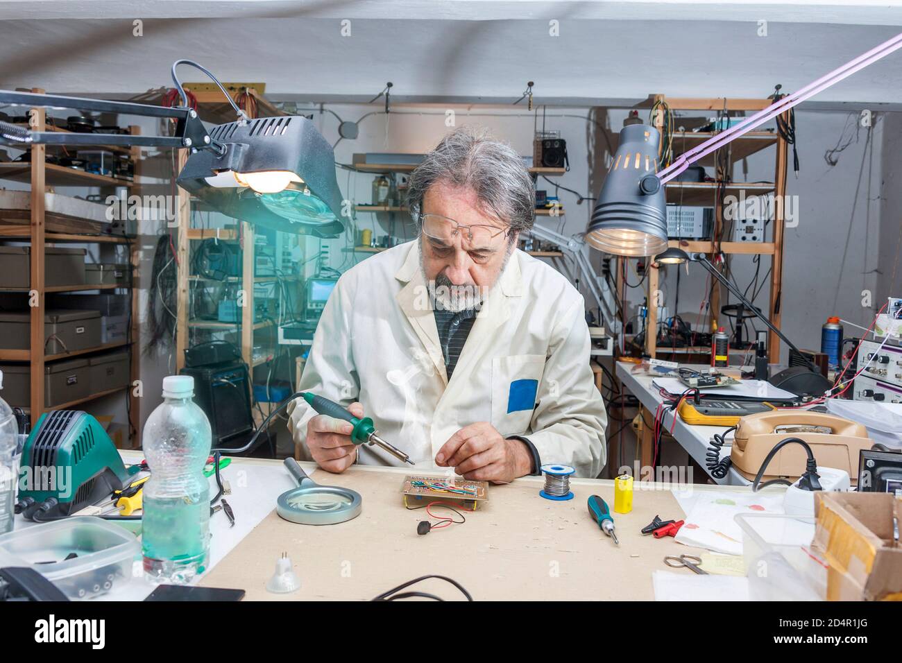electronic engineer in the laboratory with a soldering iron Stock Photo ...