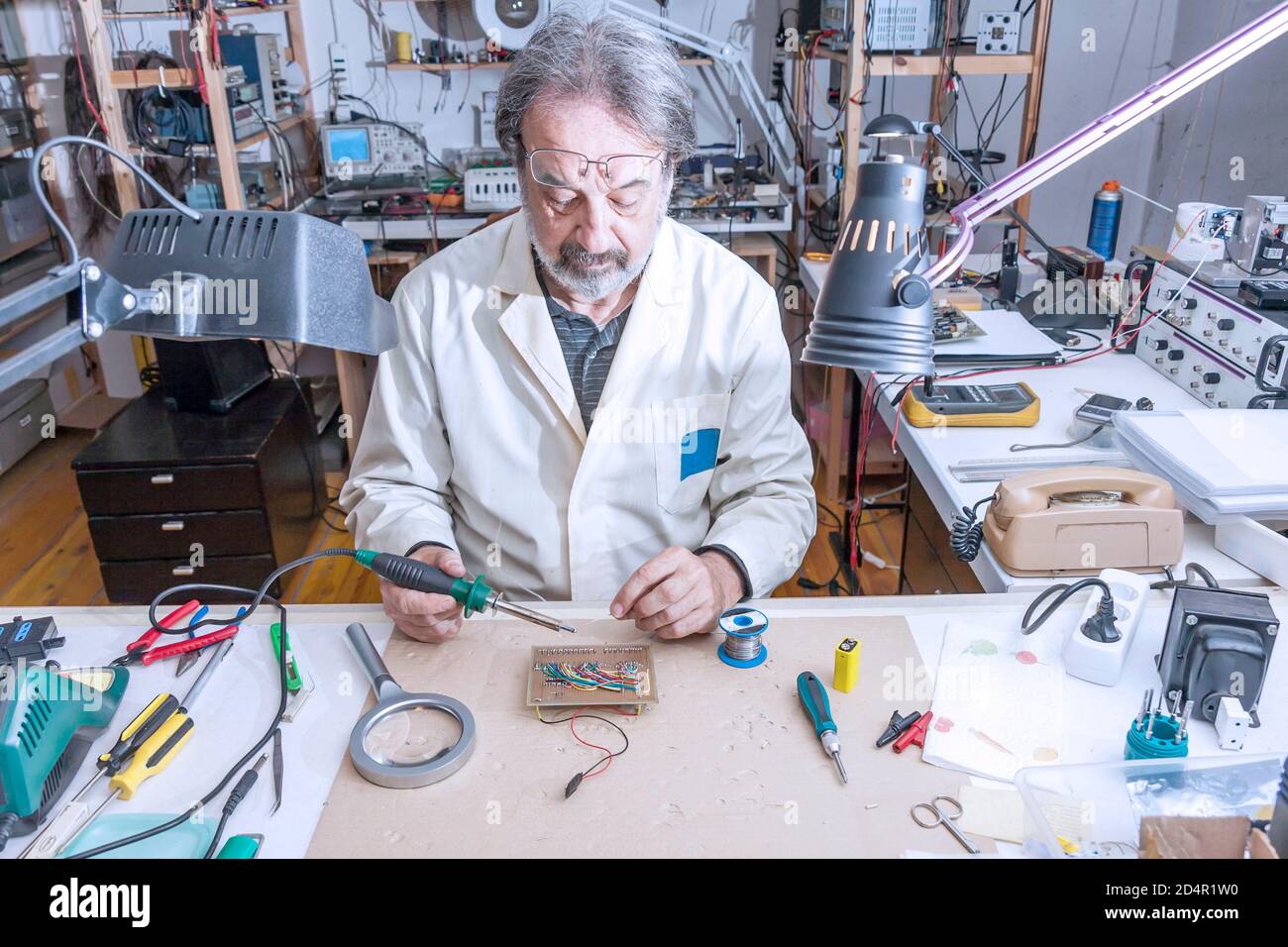 electronic engineer in the laboratory with a soldering iron Stock Photo ...
