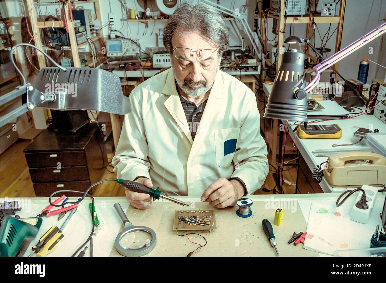 electronic engineer in the laboratory with a soldering iron Stock Photo ...
