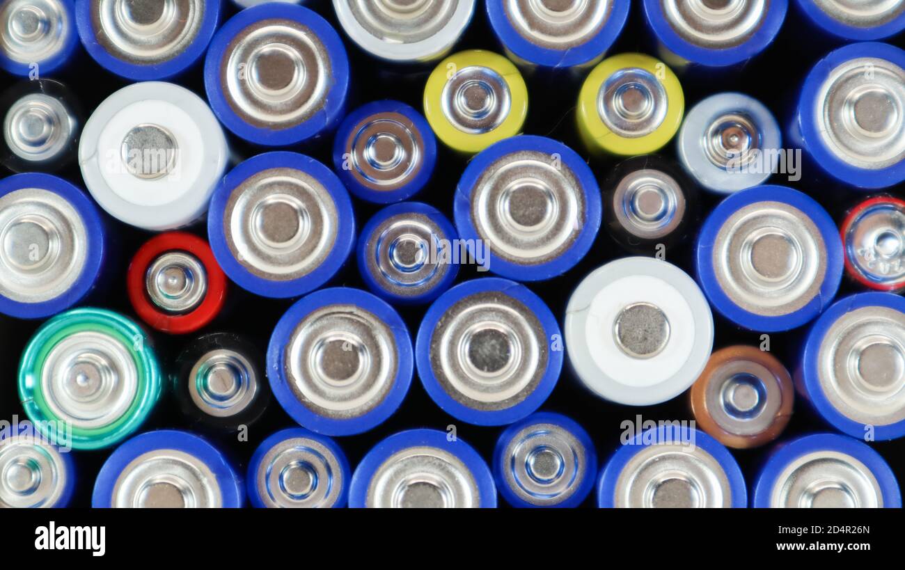 Top view of the background of AAA AA batteries and rechargeable ...