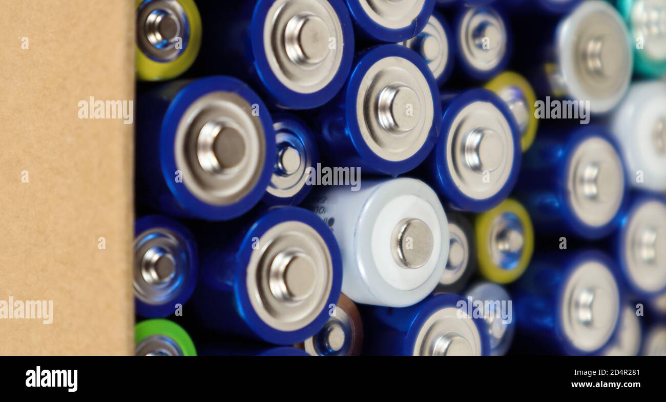 Background view of AAA AA batteries and rechargeable batteries. Choice ...