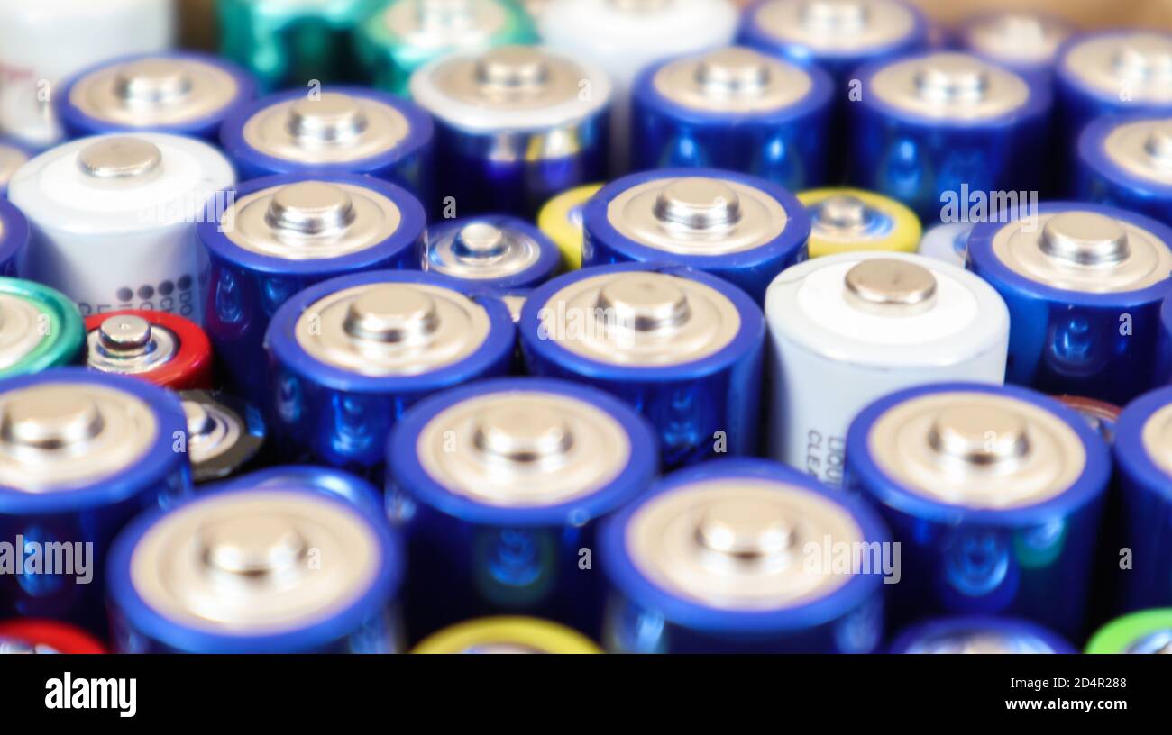 Background view of AAA AA batteries and rechargeable batteries. Choice ...