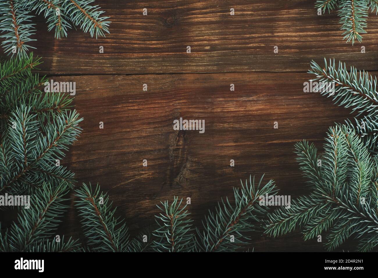 wooden background with Christmas tree branches Stock Photo - Alamy