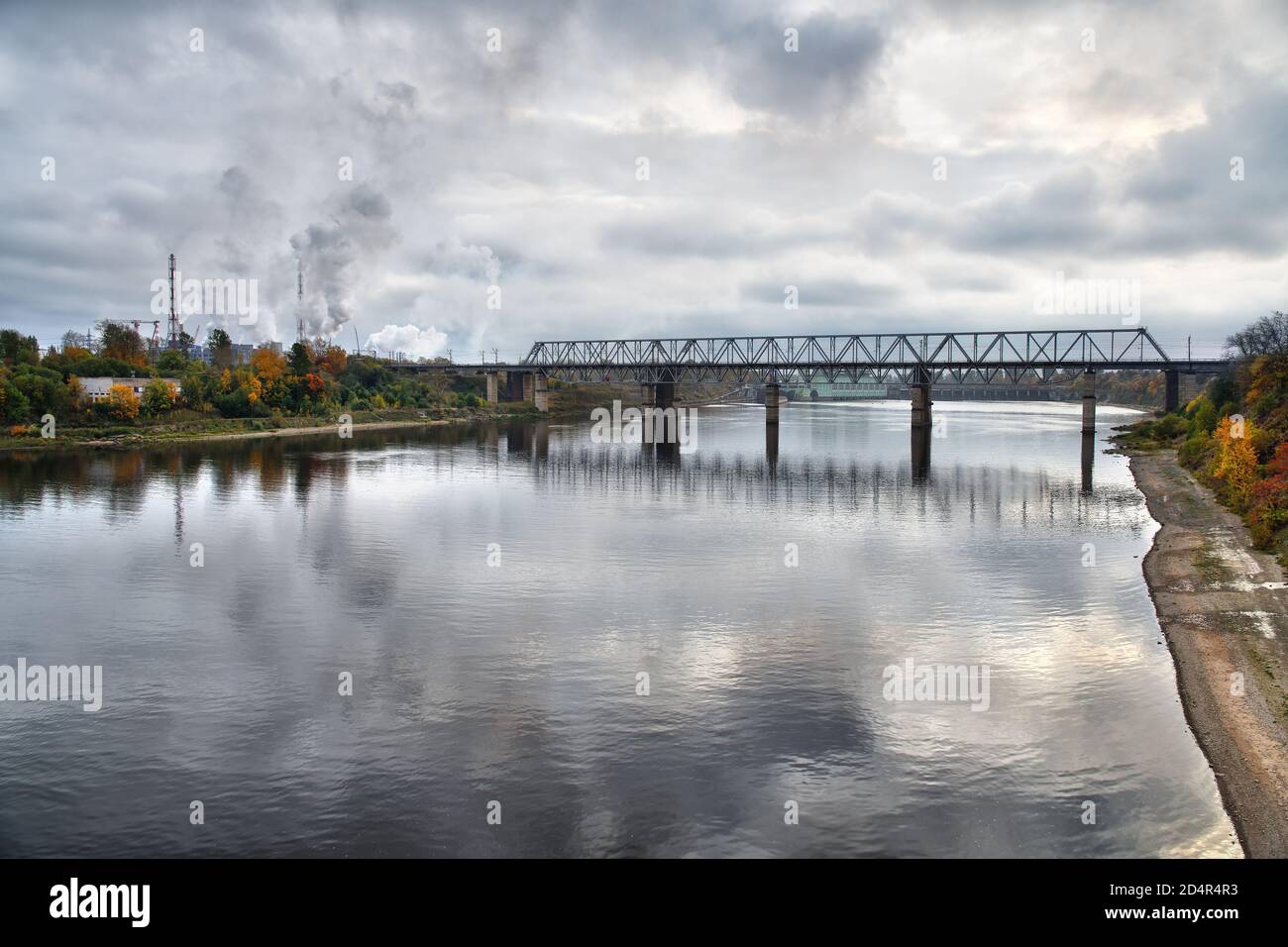 Industrial landscape. The bridge over the Volkhov river, Chemical plant ...