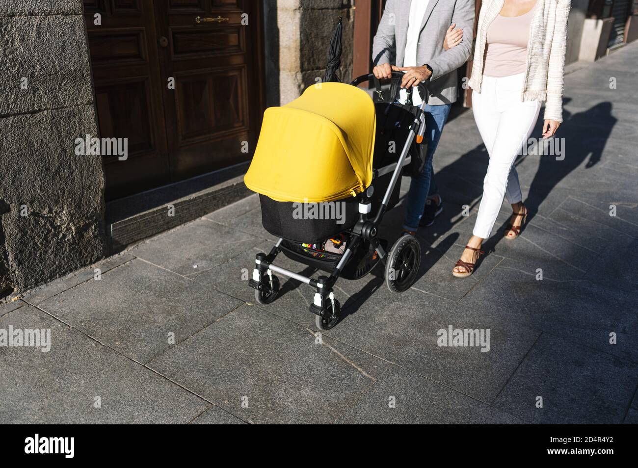 Girl pushing baby carriage hi-res stock photography and images - Alamy