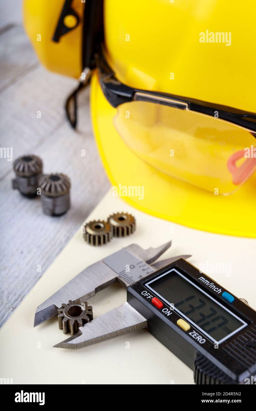 Measure small metal parts with a caliper. Accessories in the engineer's ...