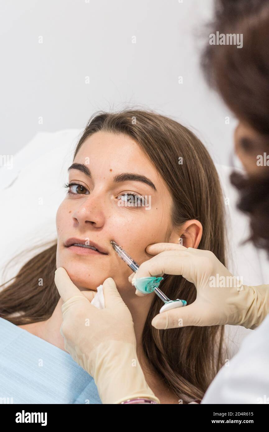 Woman receiving injections for treatment of wrinkles, France Stock ...