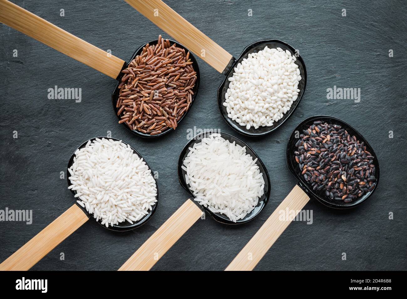 Assortment of rice in spoons, basmati rice, brown and red rice Stock ...
