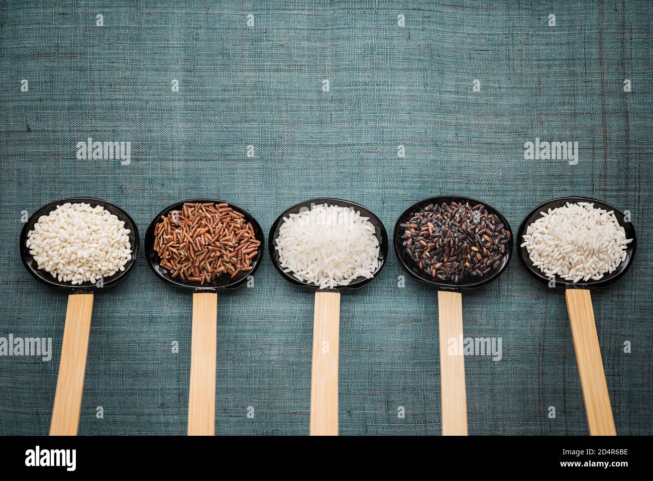 Assortment of rice in spoons, basmati rice, brown and red rice Stock ...
