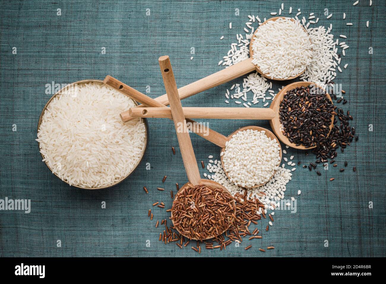 Assortment of rice in spoons, basmati rice, brown and red rice Stock ...