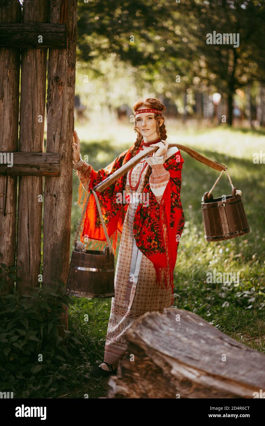 Beautiful Slavic girl with long blonde hair and brown eyes in a white ...