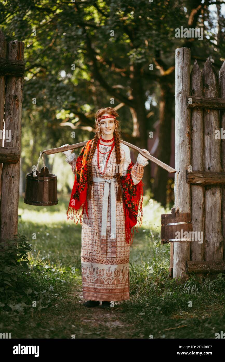 Beautiful Slavic girl with long blonde hair and brown eyes in a white ...