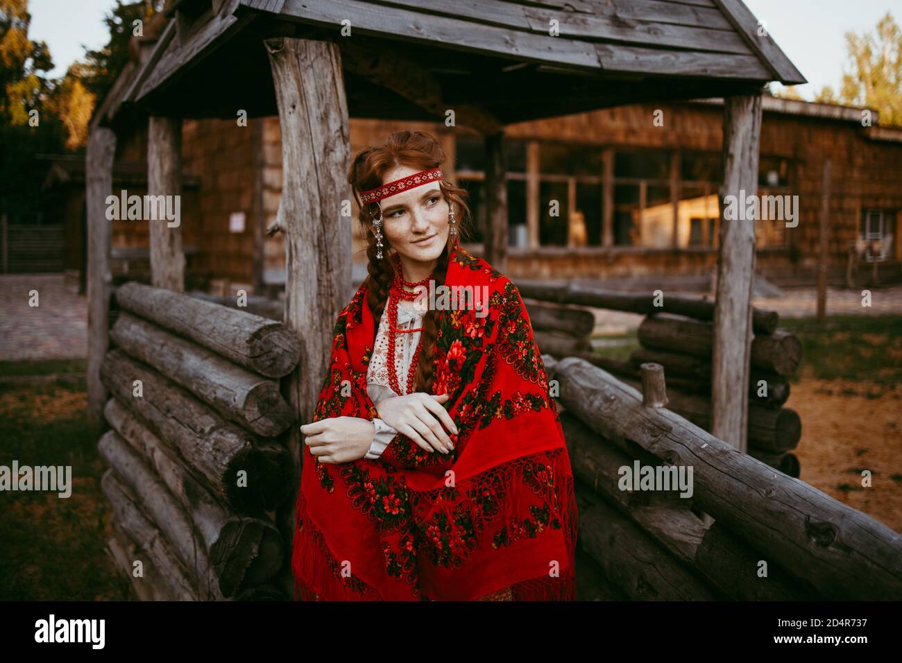 A beautiful Slavic girl with long blonde hair and brown eyes in a white ...