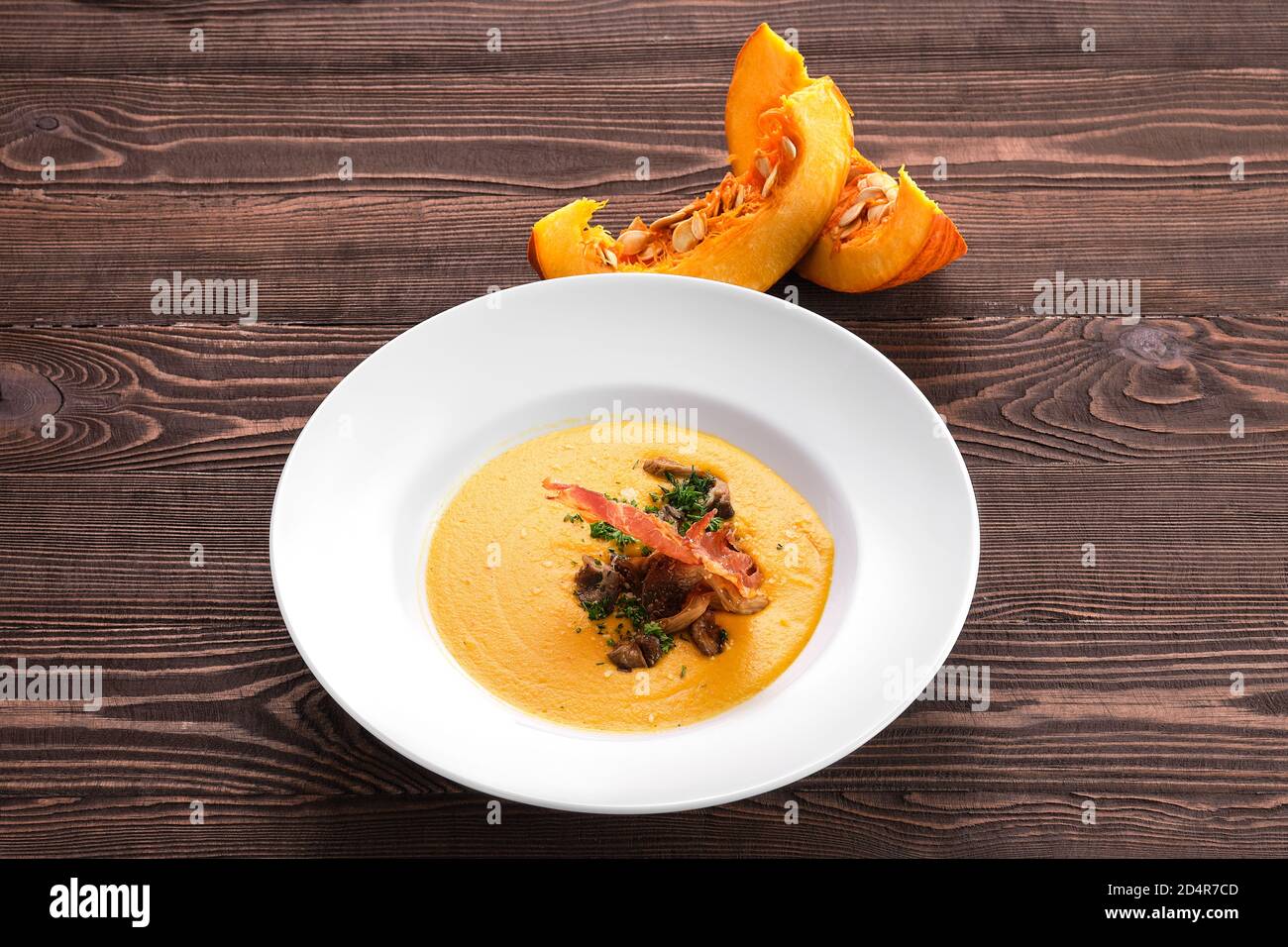Pumpkin soup puree with bacon Stock Photo - Alamy
