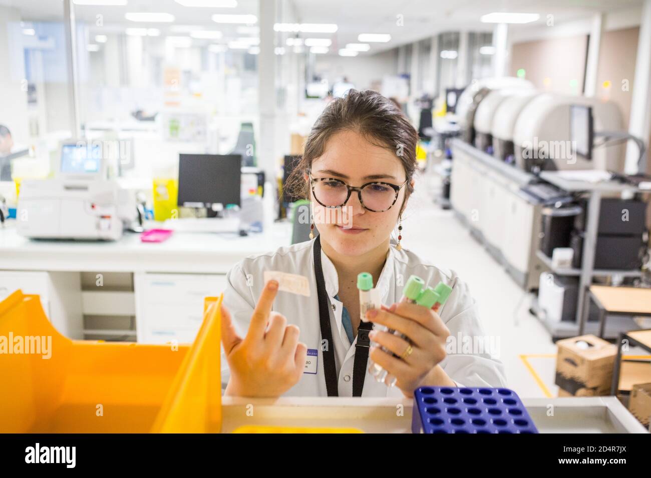Laboratory technician collecting blood samples for analysis, Emergency ...
