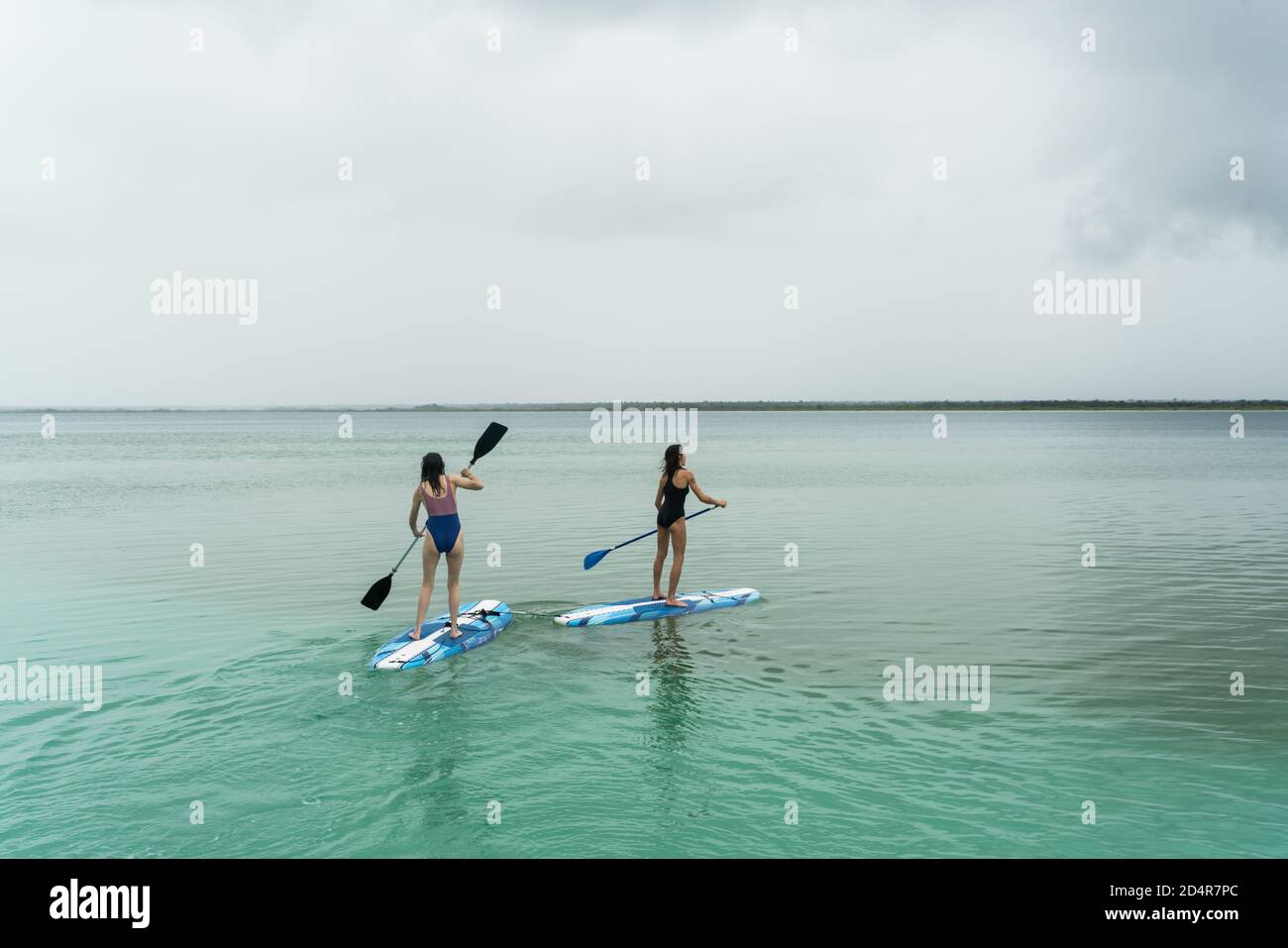Women standing up paddle hi-res stock photography and images - Alamy