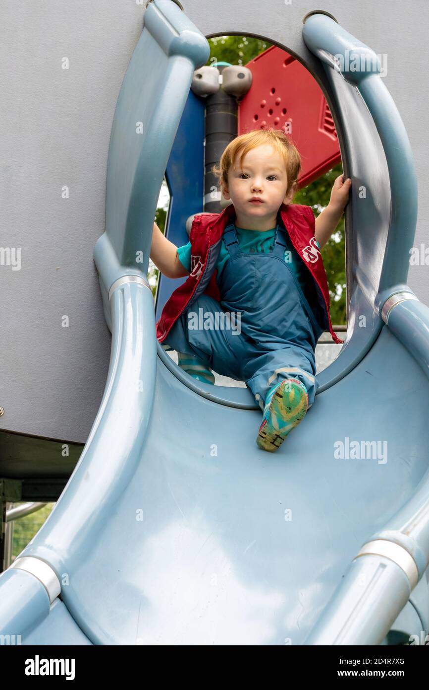 Playing on the playground in rainy weather Stock Photo - Alamy